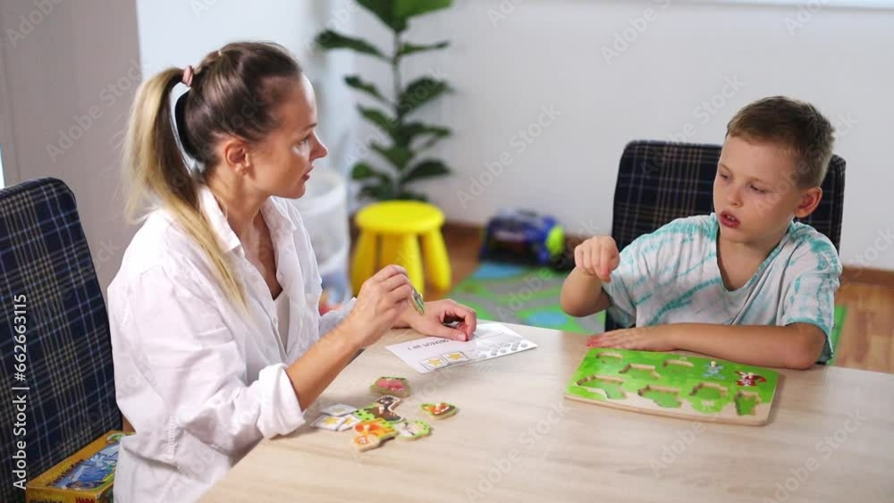 ABA Therapist Leads Therapy Session with Autistic Boy Using Color Cards ...