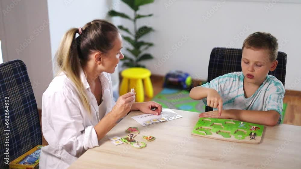 ABA Therapist Leads Therapy Session with Autistic Boy Using Color Cards ...