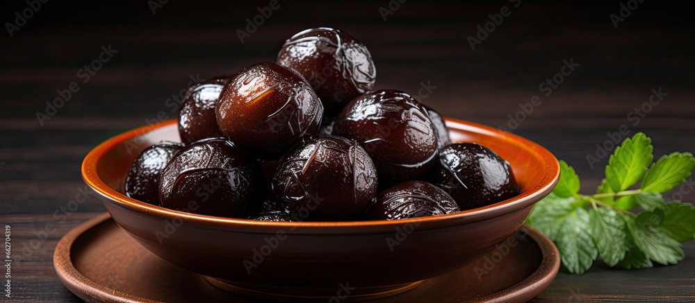 Indian dessert known as Kala Jamun also called Black Gulab Jamun or Dry ...