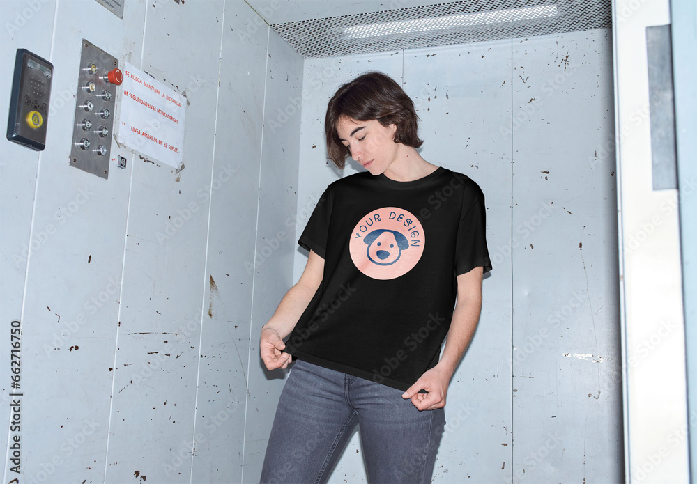 Mockup of young woman wearing customizable t-shirt in elevator, flash ...