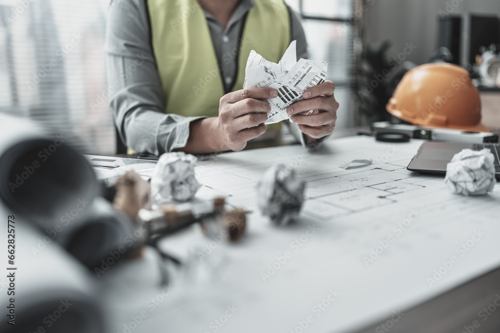 The architect made a mistake in designing the plan and torn paper ...