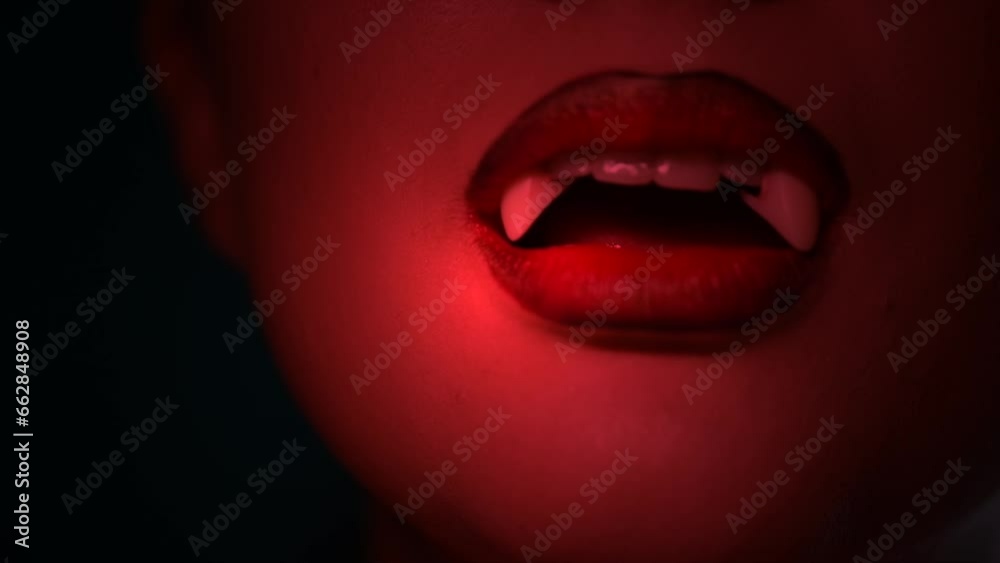 Sexy Vampire Woman's red bloody lips close-up. Vampire girl licking ...