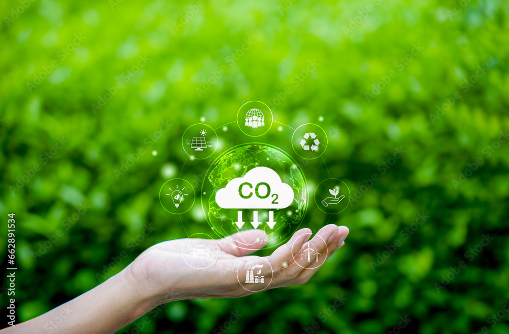 Reduce CO2 emission concept. Environmental icons in hand. Carbon ...
