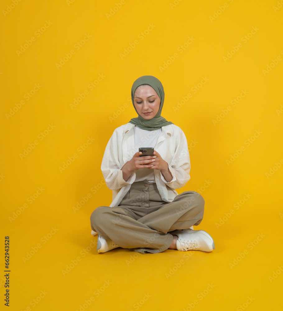 Use mobile cell phone, full body young muslim woman in hijab use mobile ...