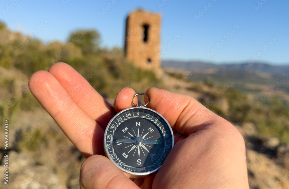 Compass in hand in mountains. Tourist compass for orientation on ...