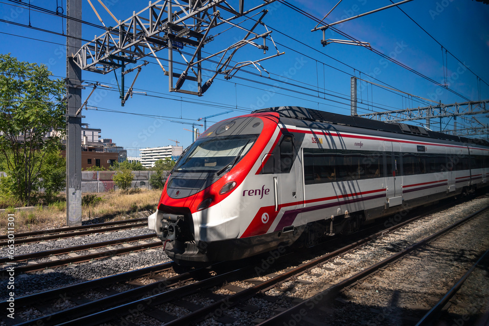 National network train of the Spanish railways Renfe leaving Atocha ...