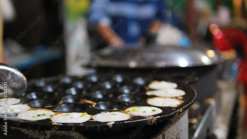 Asian street food: traditional Thai Kanom Krok dessert coconut-rice ...