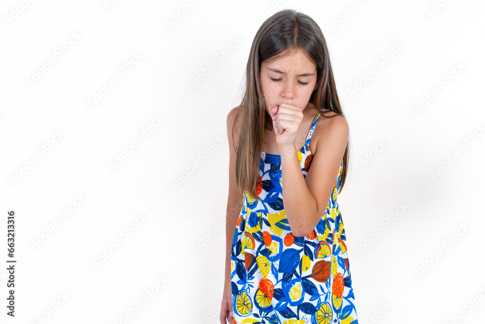 Beautiful little kid girl wearing colorful dress feeling unwell and ...