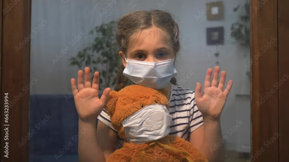 Protection of children, medical. Sad girl in protective medical mask at ...