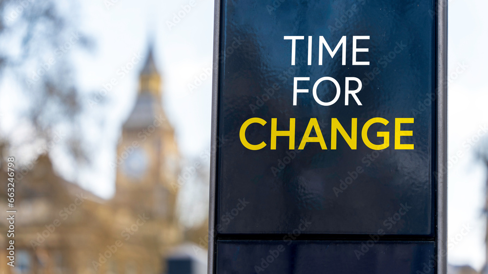 Time for change written on a sign with Elizabeth Tower and Big Ben in ...