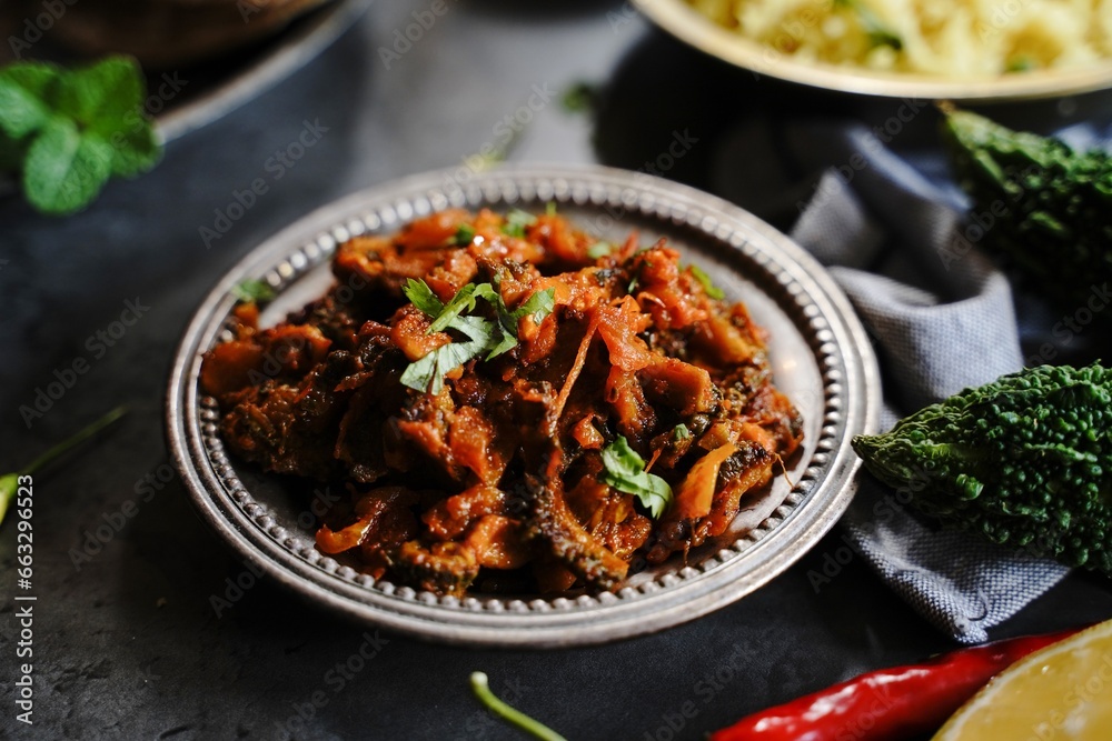 Bitter gourd curry - karela subji served with rice and roti, selective ...