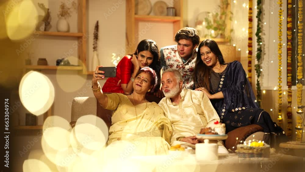 Happy smiling Hindu ethnic Indian family members in traditional attire ...