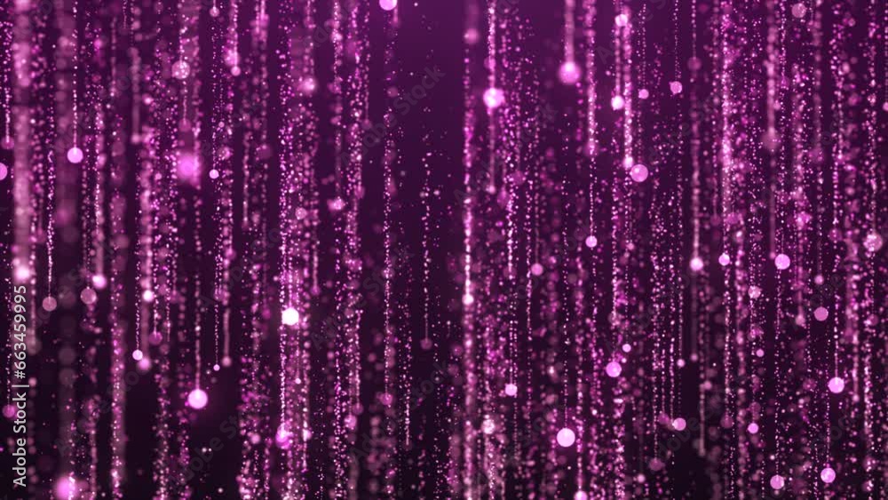 Shiny rose gold particles gracefully falling on purple gradient ...