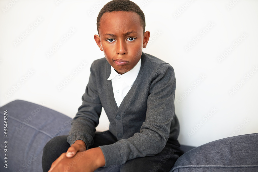 Puzzled perplexed black teen boy looking at camera with curved lips and ...