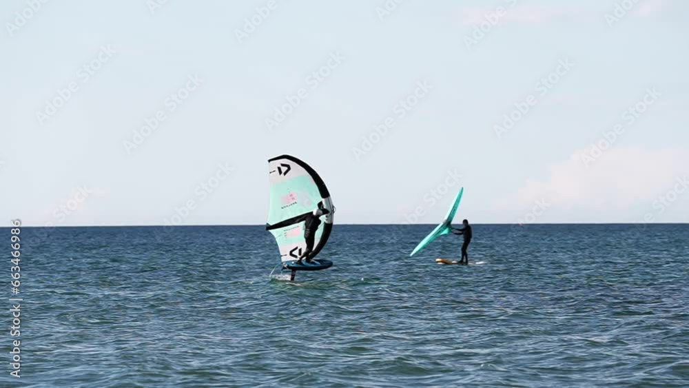 Modern water sport. Hydrofoil ride on the ocean using the wing and the ...