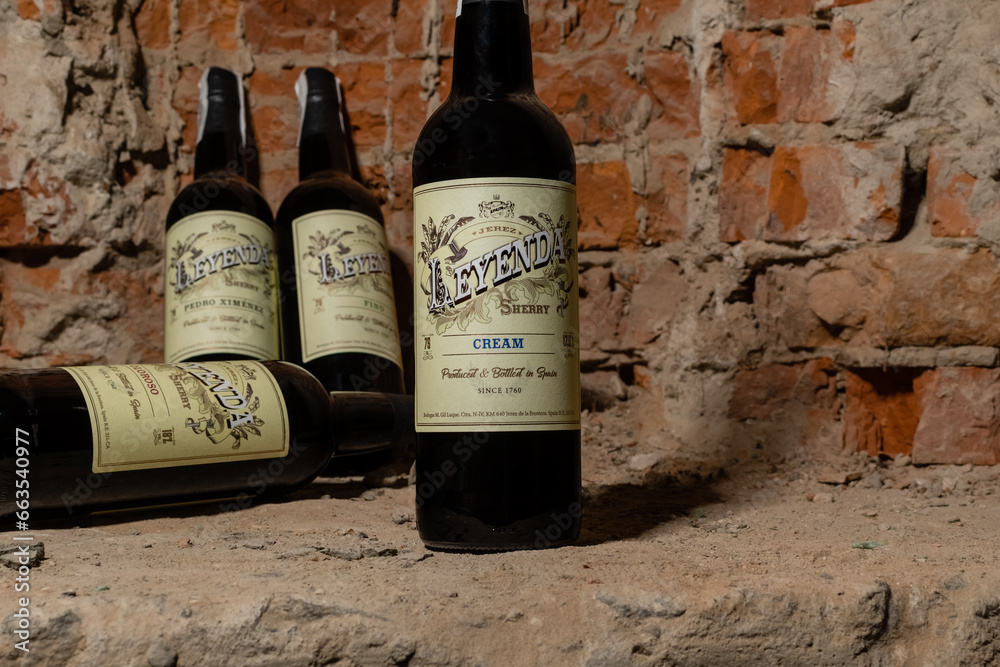 Bottles of spanish sherry Leyenda on brick wall background. Ukraine ...