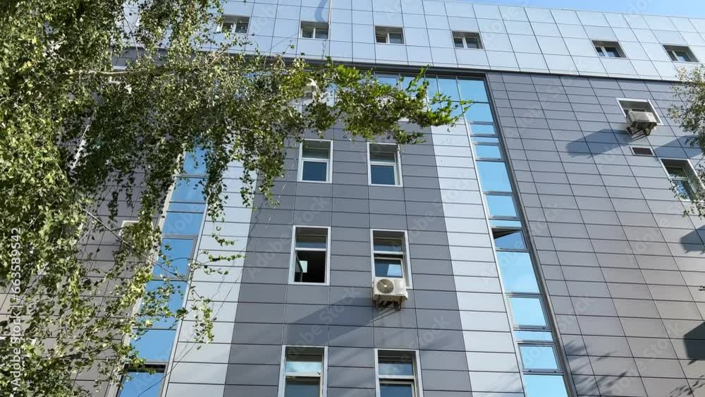 Modern factory office building, covered with metal building cladding ...
