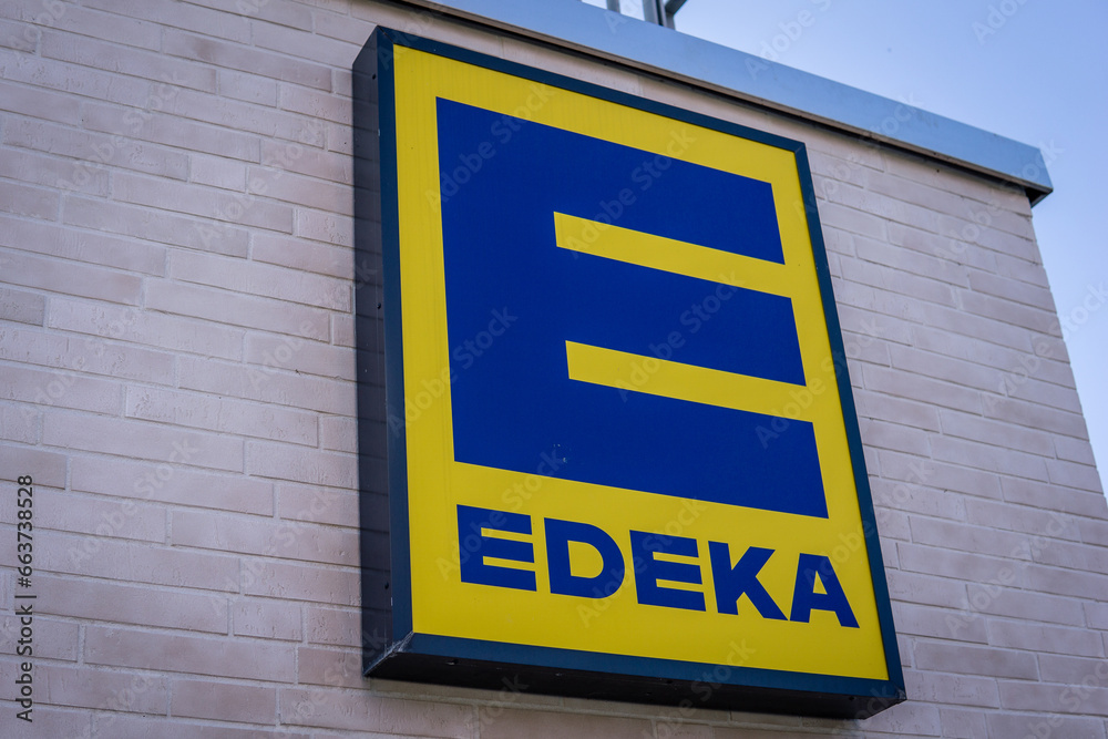 Munich, GERMANY - 10. September 2023: Sign at the entrance of an EDEKA ...