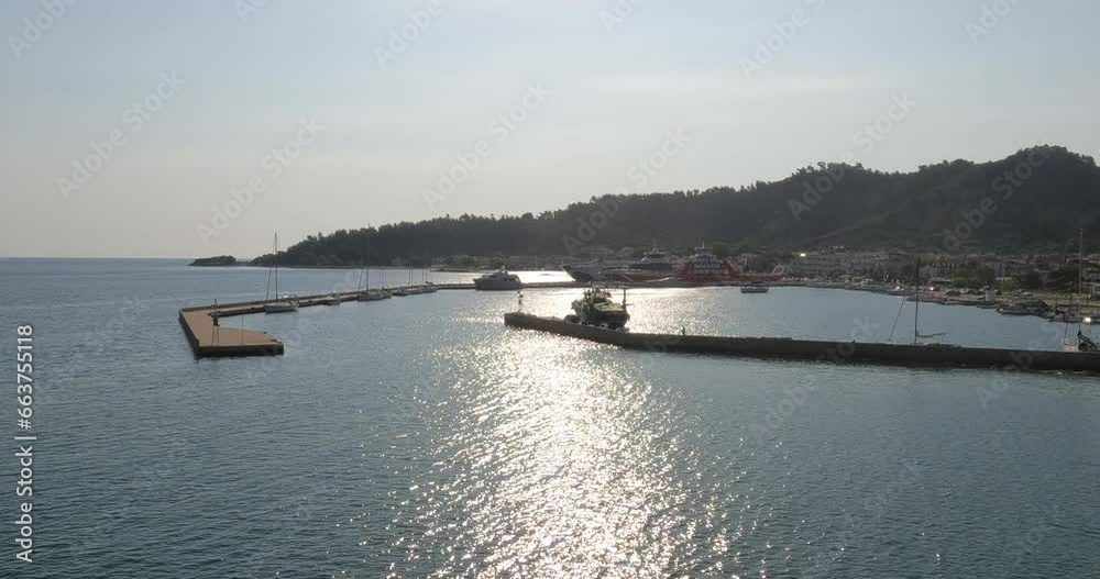 Ferry boat port, sun glitter reflection on sea water. Summer travel ...