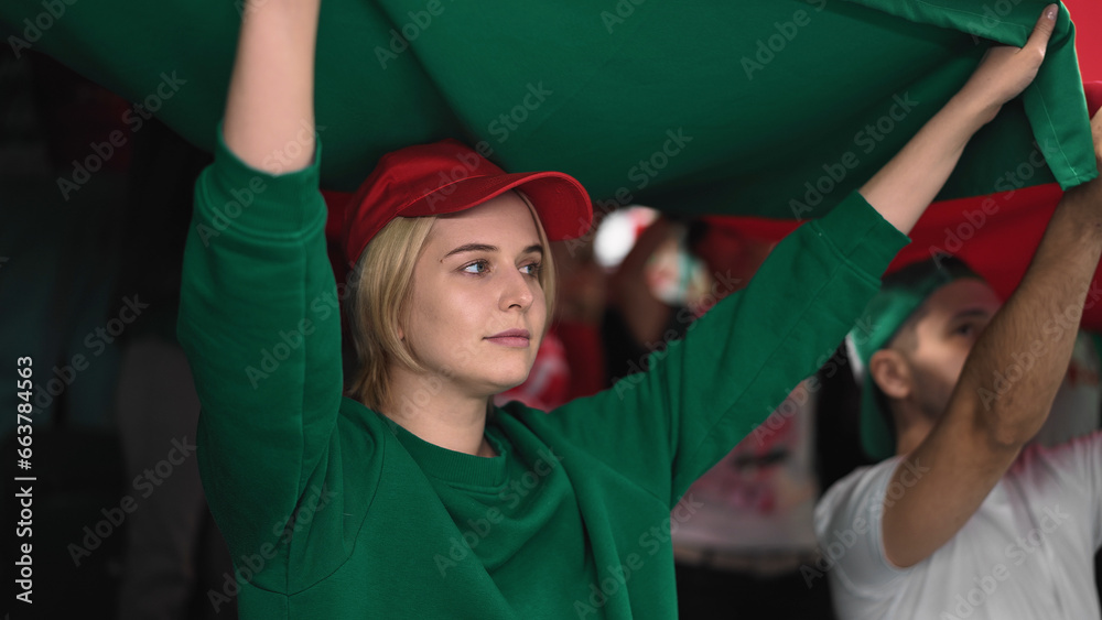 Fans hold win flag football sport stadium. Patriotic people pride ...