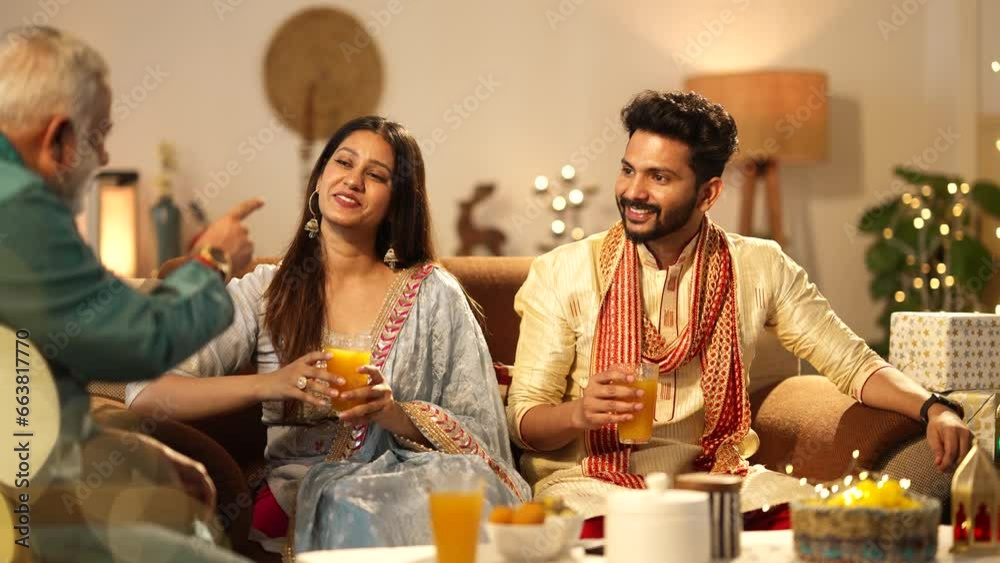 Indian couple and relative drinking juice during diwali festivel and ...
