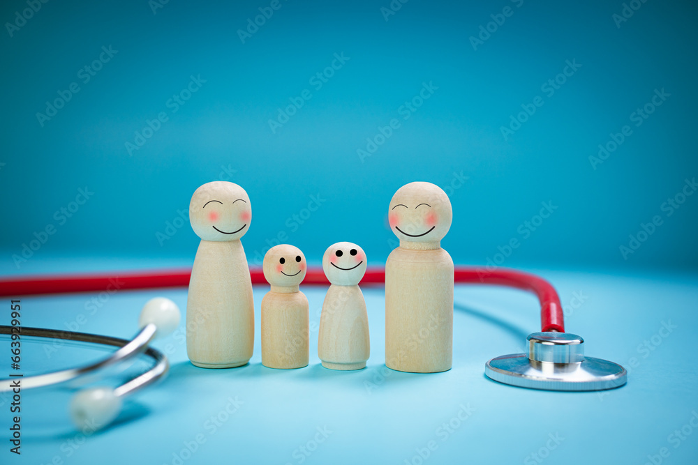 Health insurance concept, wooden dolls, family of parents and children ...