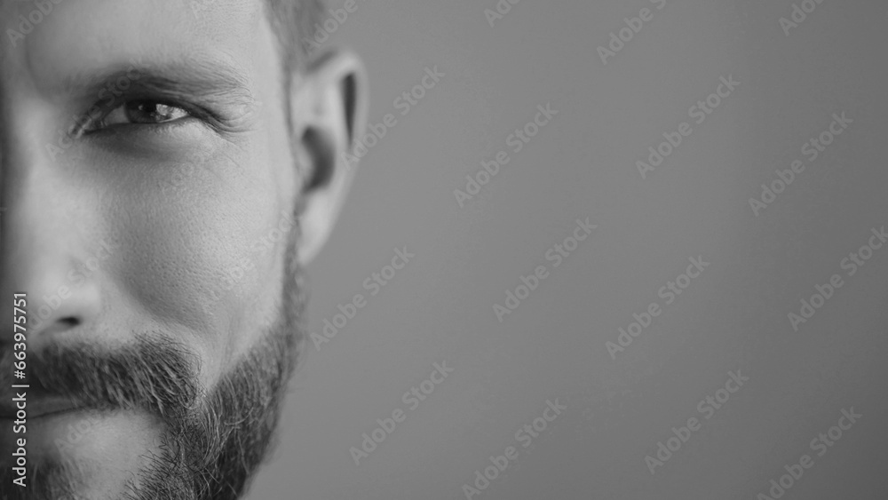 Extreme close-up, headshot half face of a confident young man 30s ...