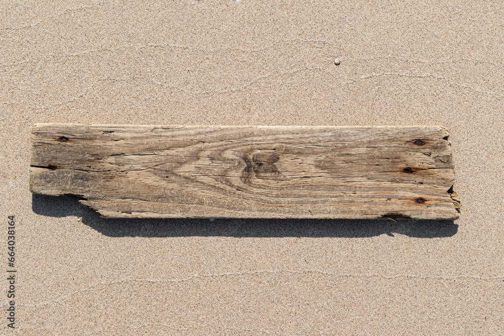 Sea drift wood plank isolated on beach sand background. Template mockup ...