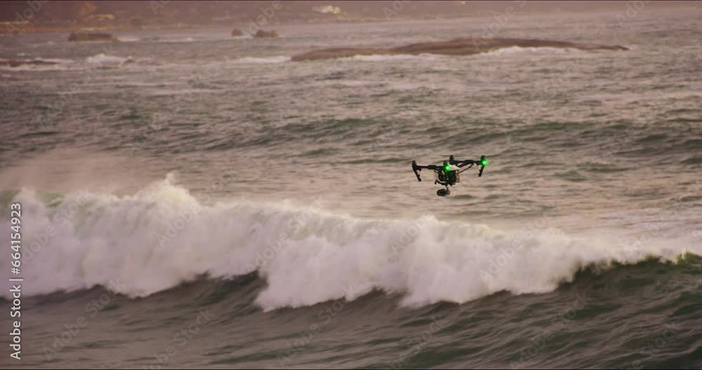Drone, ocean and flight of technology in air outdoor, spy or video ...