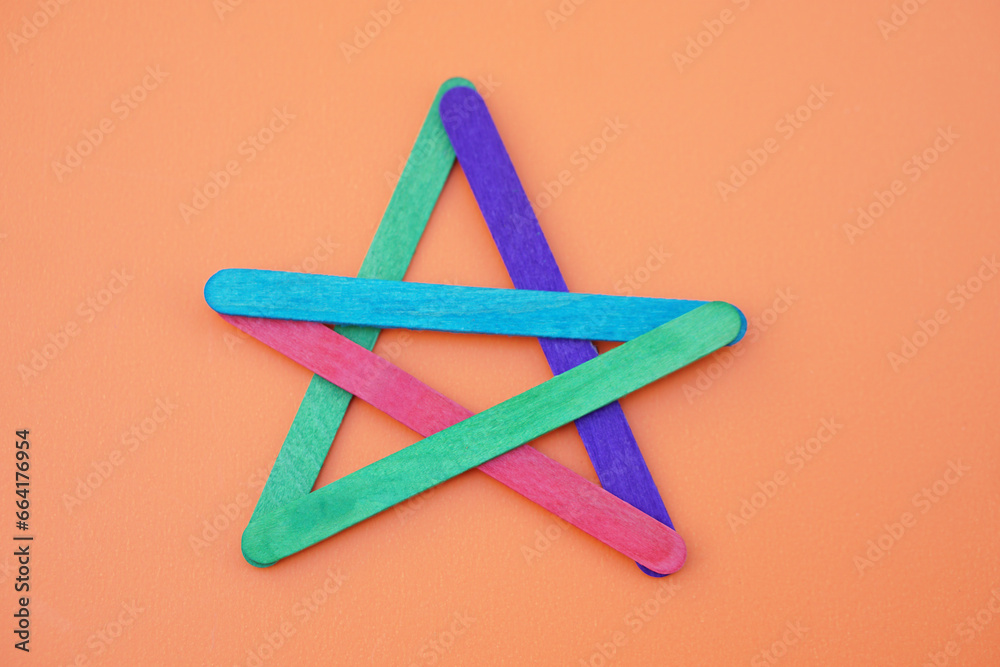 DIY colorful used ice cream sticks in star shape. Concept, teaching ...