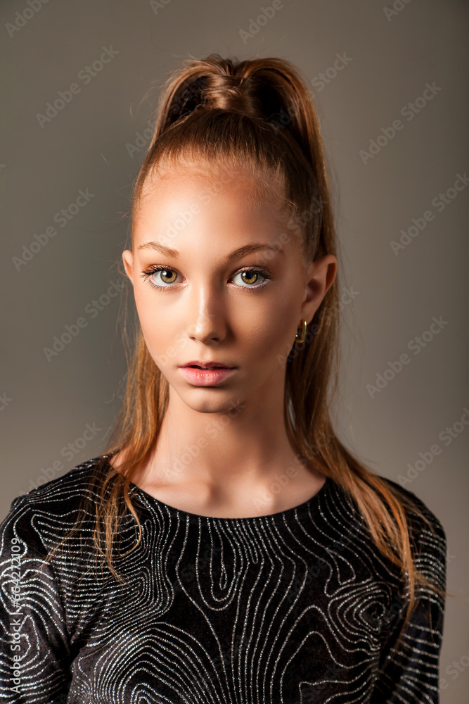Close up portrait of lovely teen cover girl 14 year old posing at grey ...
