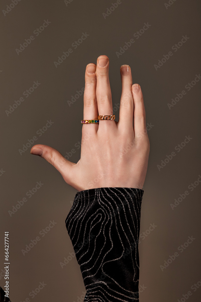 Hand of teen girl showing fingers gesture doing image symbol. Hands ...