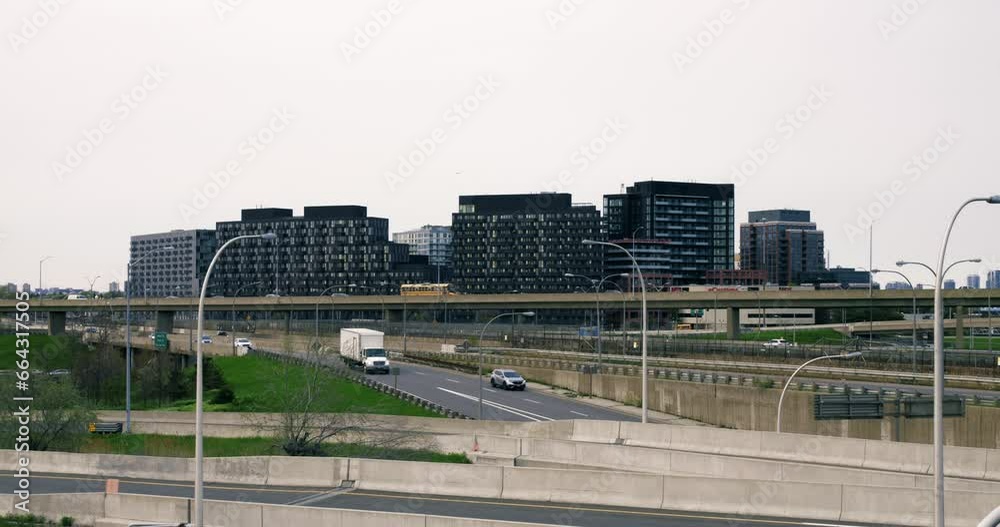 Trucks and cars moving on freeway in metropolis. Wide view of busy ...