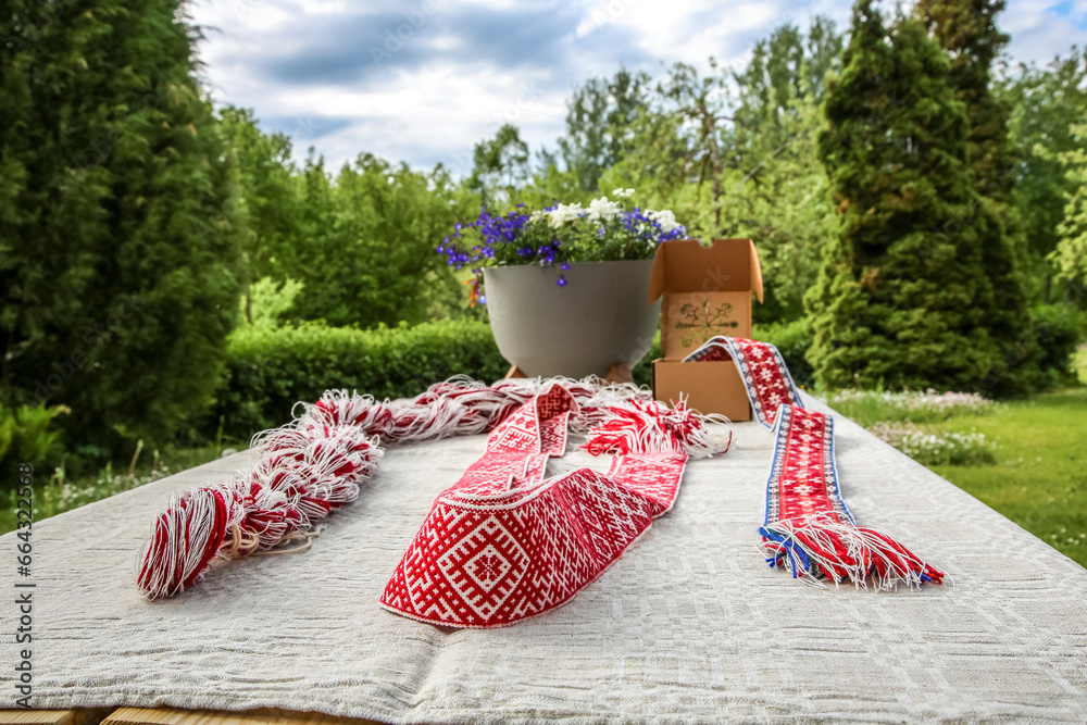 National symbols of Latvia is Lielvarde belt in traditional black and ...