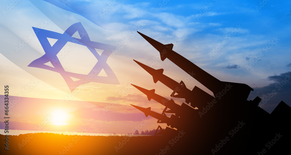The missiles are aimed at the sky at sunset with Israel flag. Nuclear ...