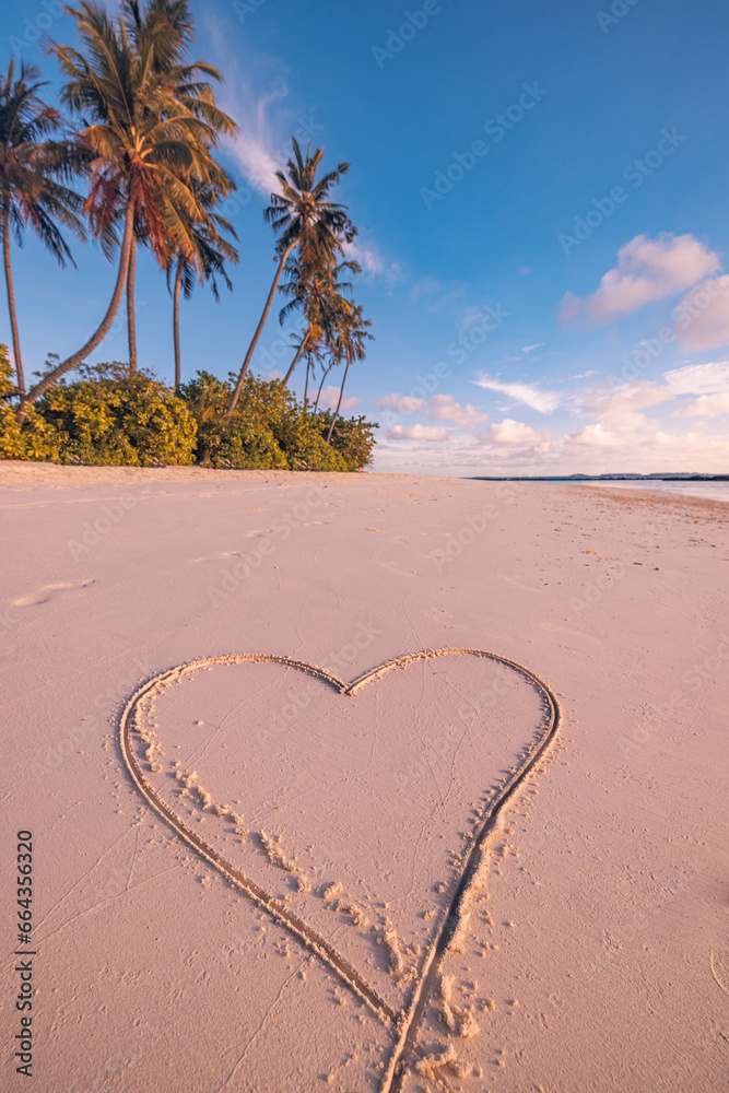 Tropical island beach with heart shape in sand. Idyllic romantic love ...
