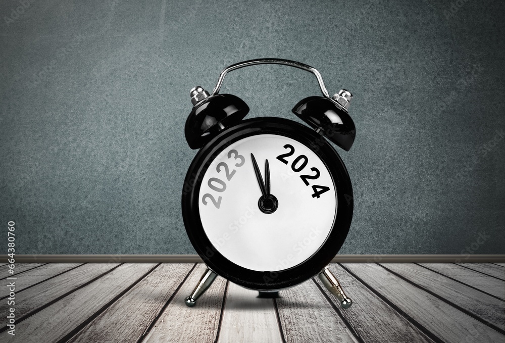 2023 and 2024 numbers on alarm clock Stock Photo | Adobe Stock
