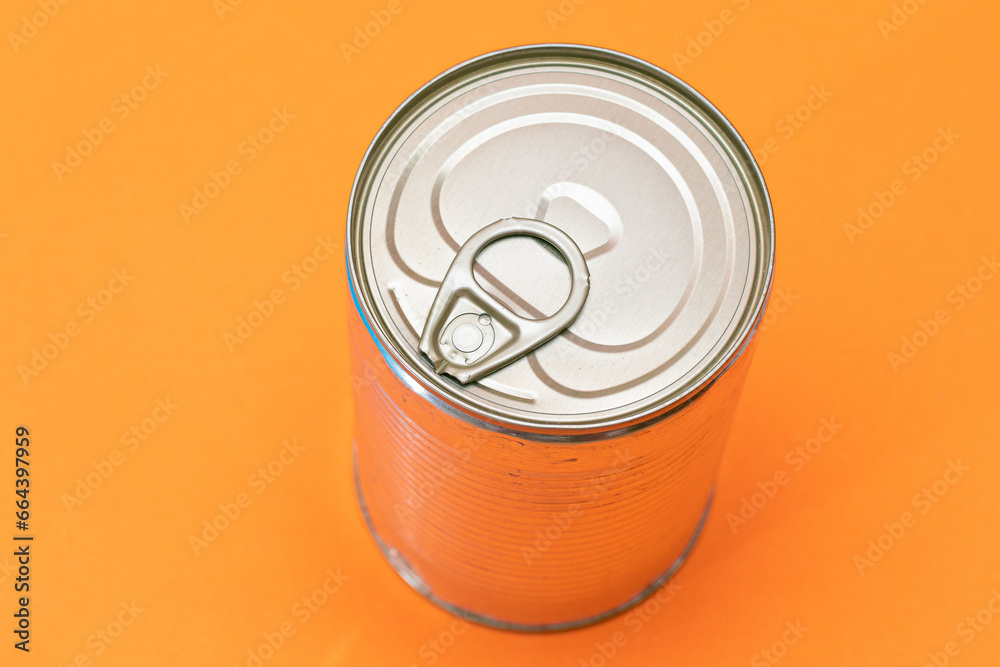 Unopened Tin Can with Blank Edge on Orange Background. Canned Food ...