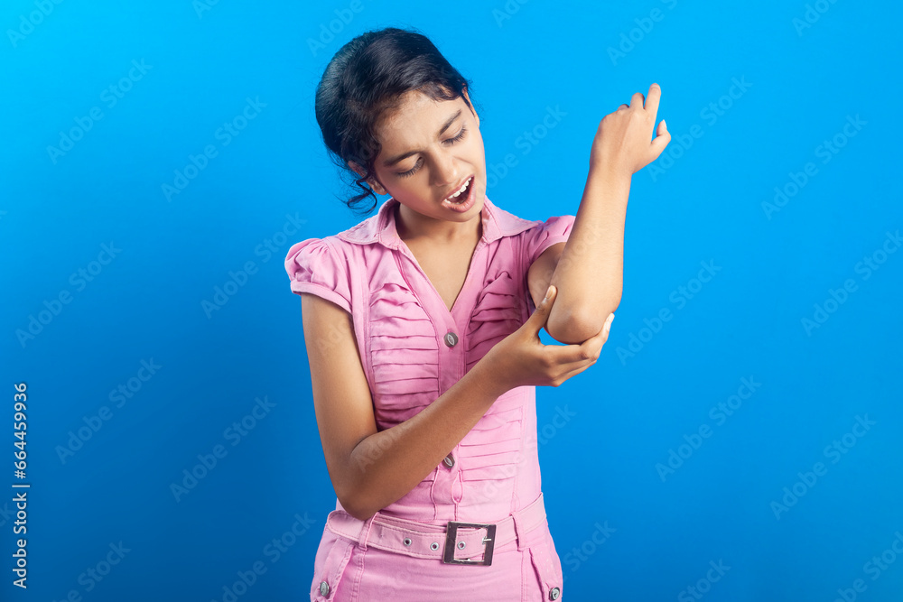 One Indian girl touching her elbow injury with pain Stock Photo | Adobe ...