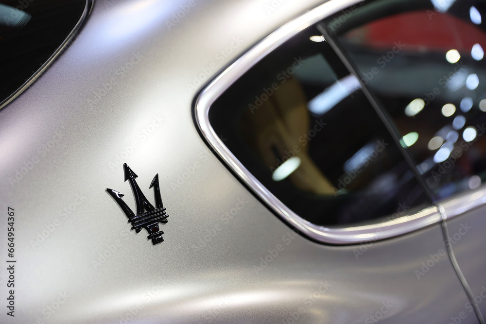 Lateral back view of logo with detail of a luxury sports car Maserati ...