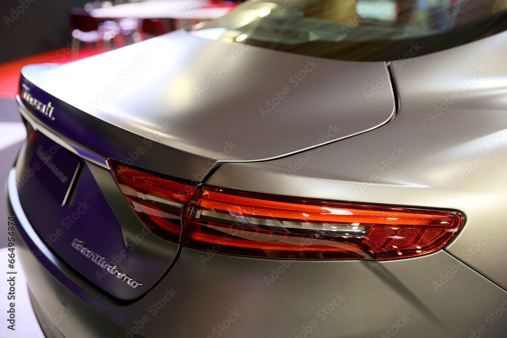 Lateral back view and detail of rear light of a luxury sports car ...