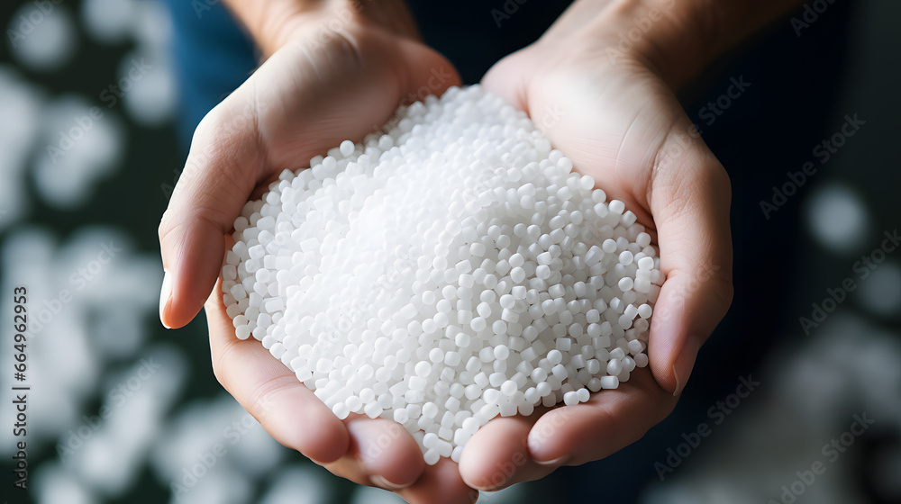 White plastic grain, plastic polymer granules,hand hold Polymer pellets ...