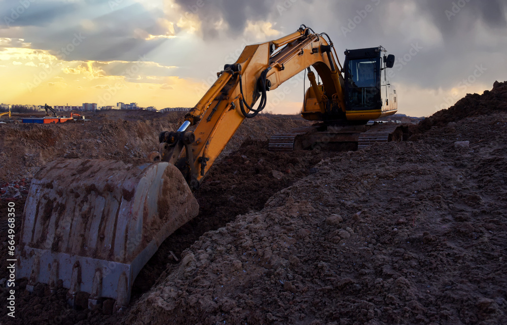 Excavator dig ground at construction site. Dig foundation. Construction ...