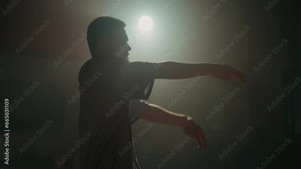 Young man dancing contemporary hip hop on red background with white ...