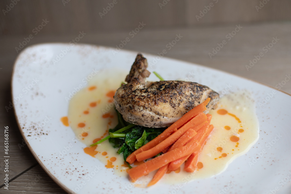Sous Vide Pan-Seared Chicken Breast Over Spinach, Carrots, and Sauce ...