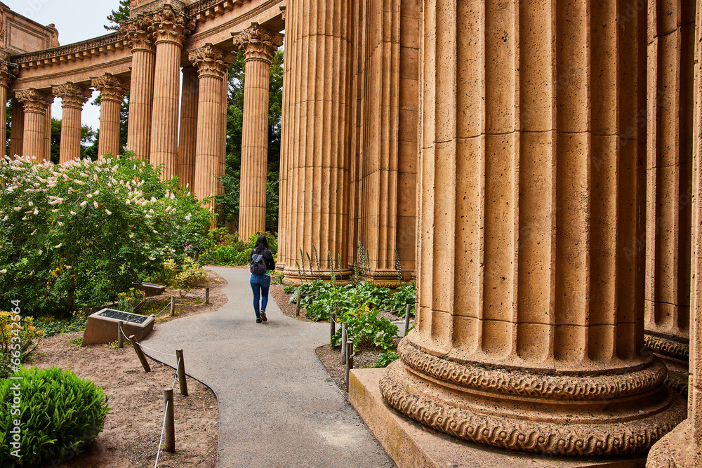 Photo & Art Print Person walking beside Ancient Roman colonnade ...