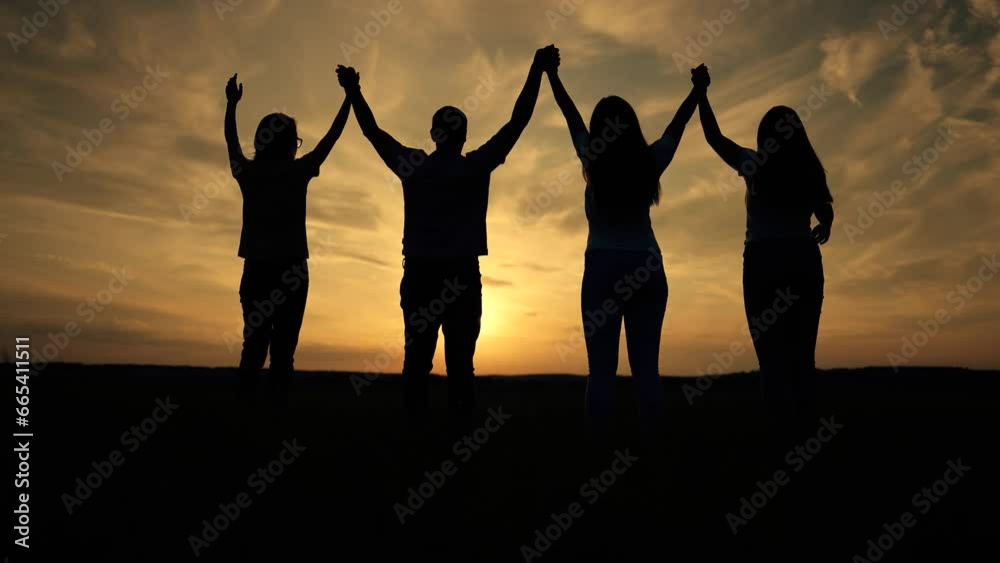 Silhouette of group of people. People holding hand together symbol of ... Silhouette of group of people. People holding hand together symbol of ...