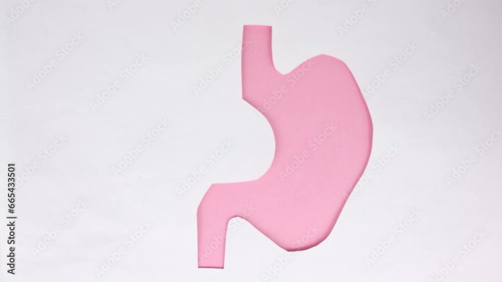 Person taking stomach pill close up. Stop motion animation. Inside ...