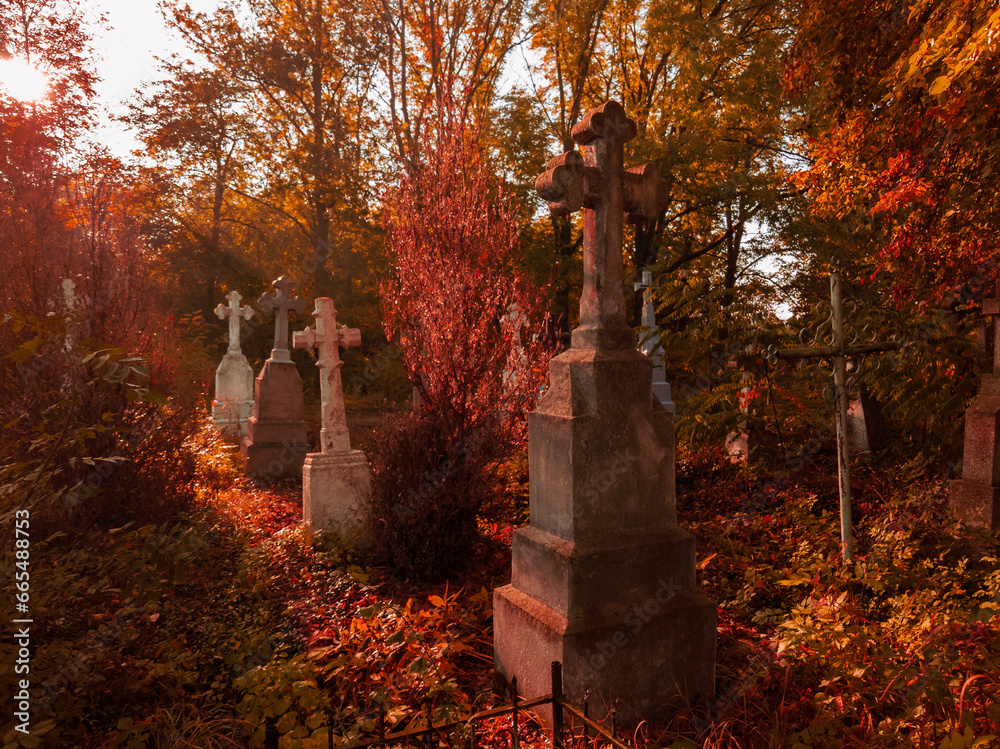 Autumn graveyard. Stone crosses in an old abandoned cemetery in the ...