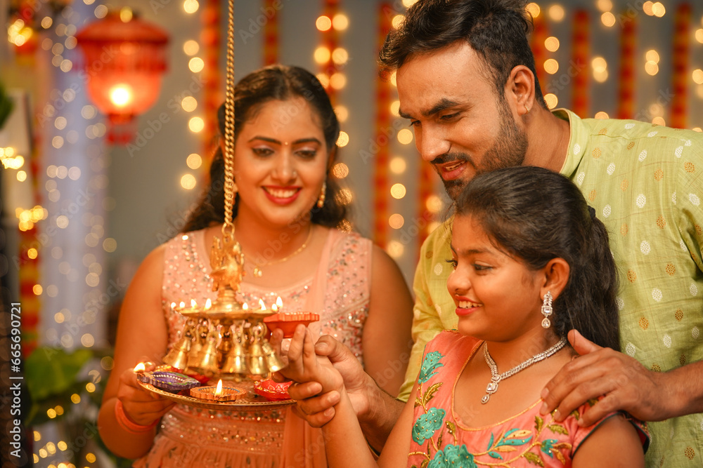 focus on father, Indian supportive father and mother with daughter ...